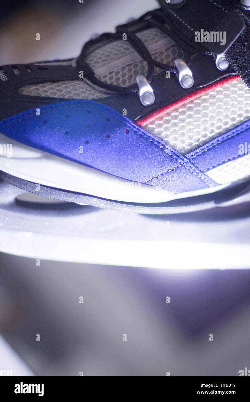 Ice skates in skate store shop window on display on sale for skating on ...