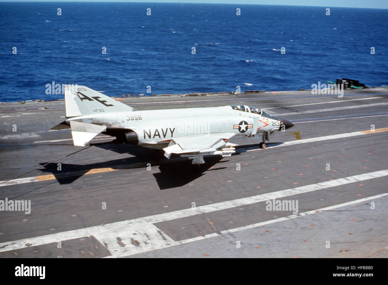 A Fighter Squadron 33 (VF-33) F-4J Phantom II aircraft lands aboard the ...