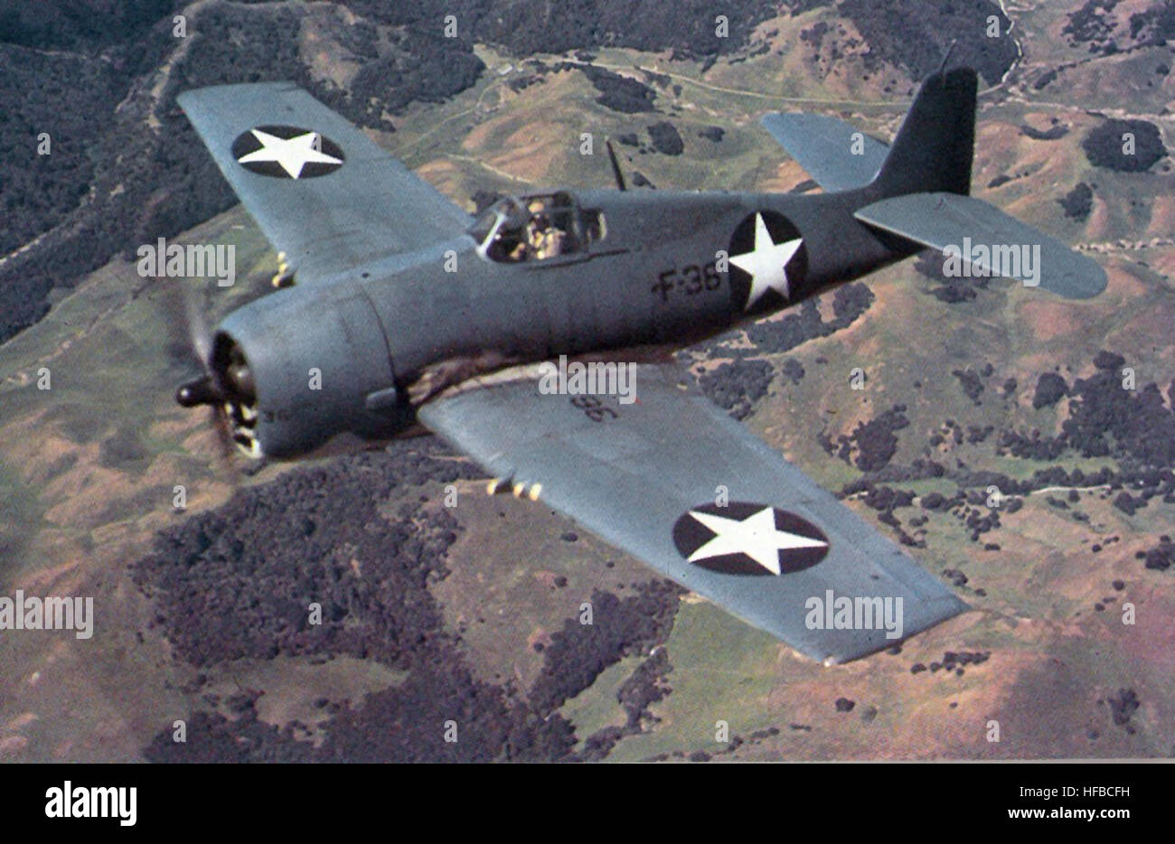 A Grumman F6F-3 Hellcat fighter aircraft flies over California in 1943 ...