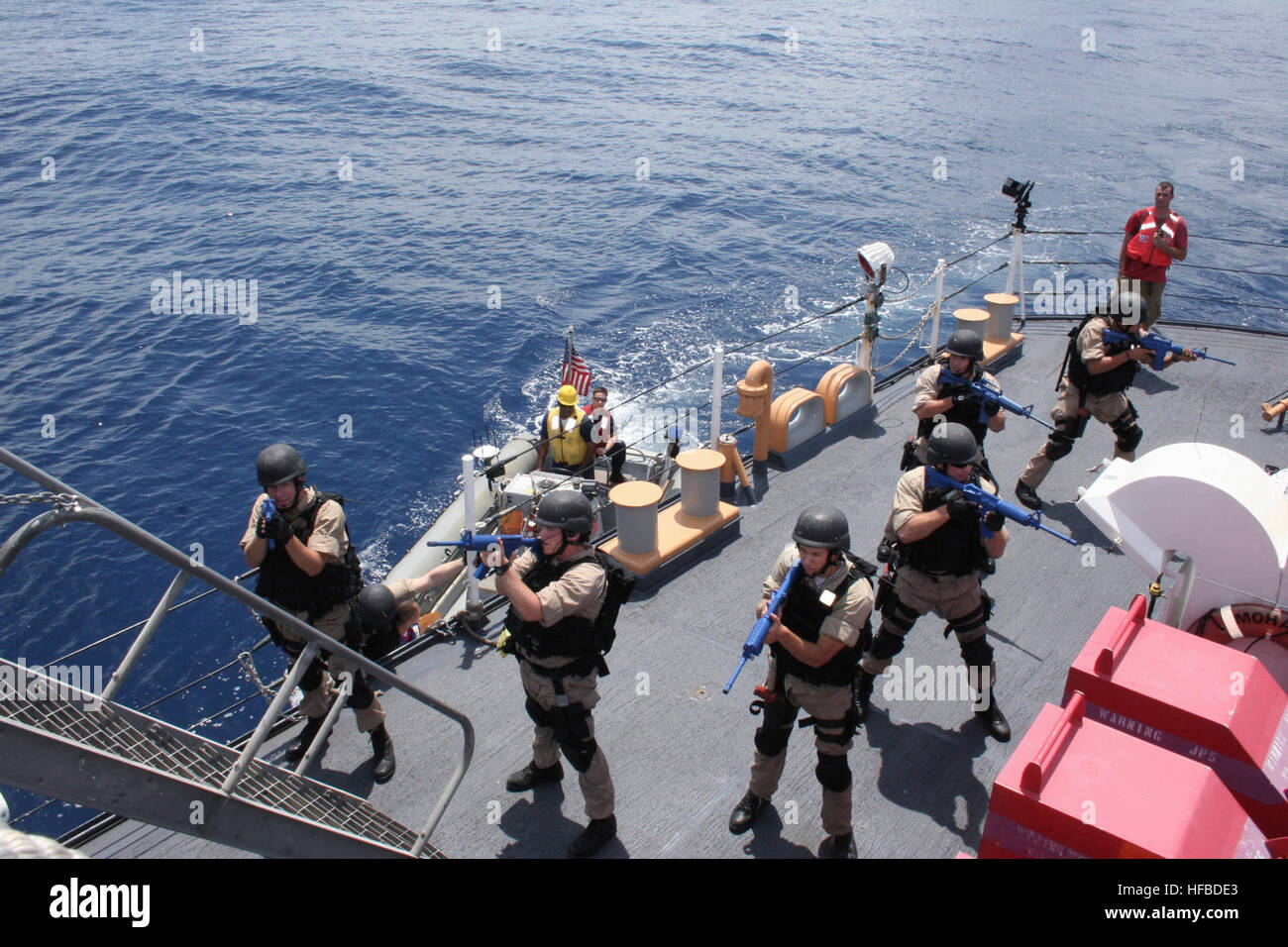 A U.S. Navy boarding team from the guided-missile frigate USS Doyle ...