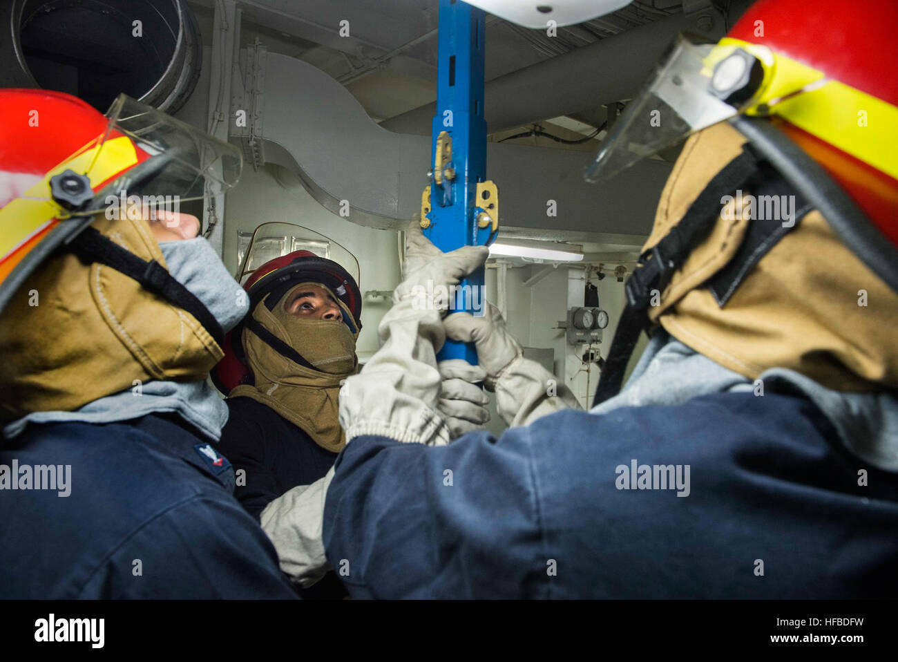 Sailors aboard USS Ronald Reagan (CVN 76) conduct a damage control ...