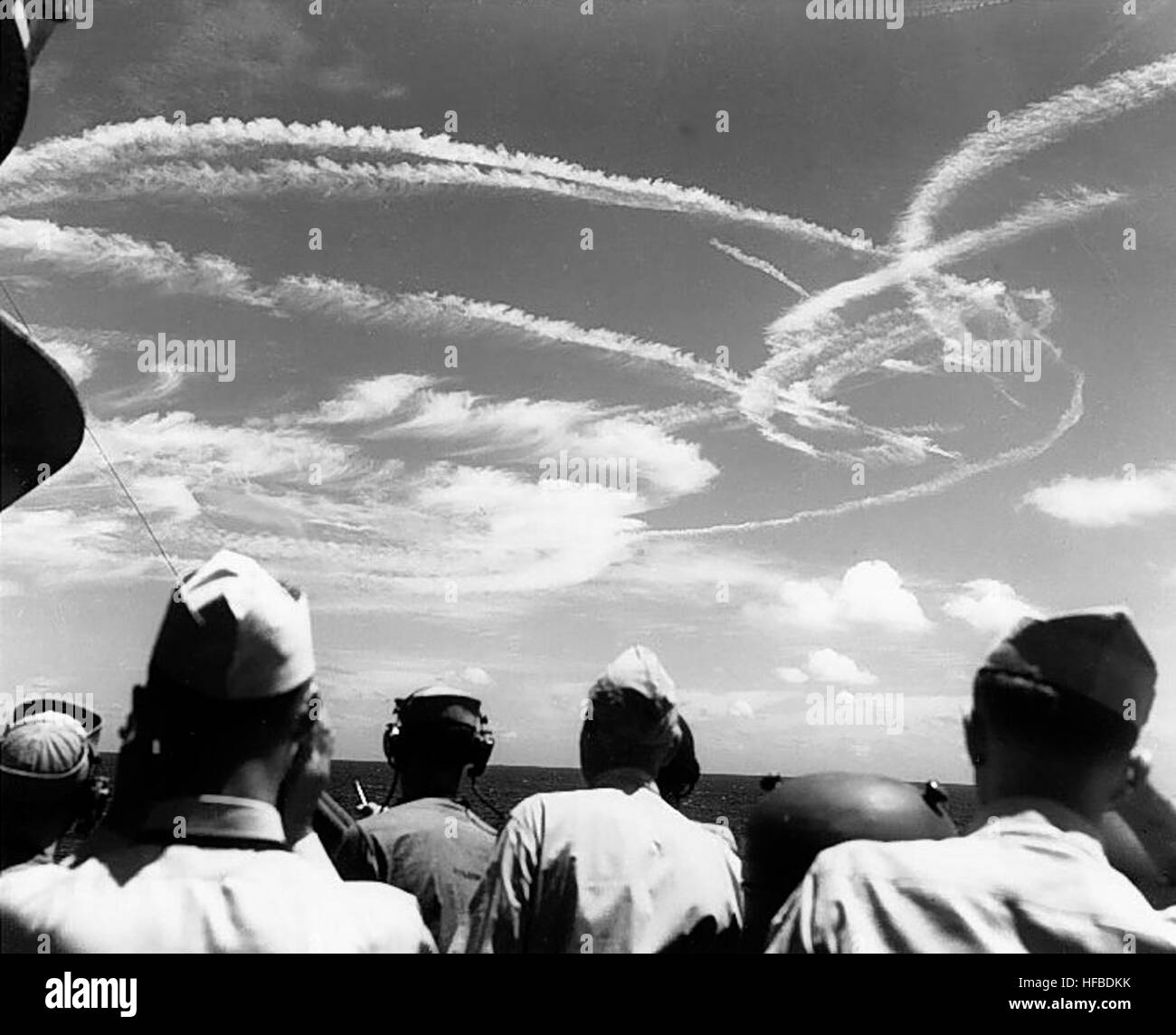 Contrails form behind military fighter jets during high-altitude flight ...