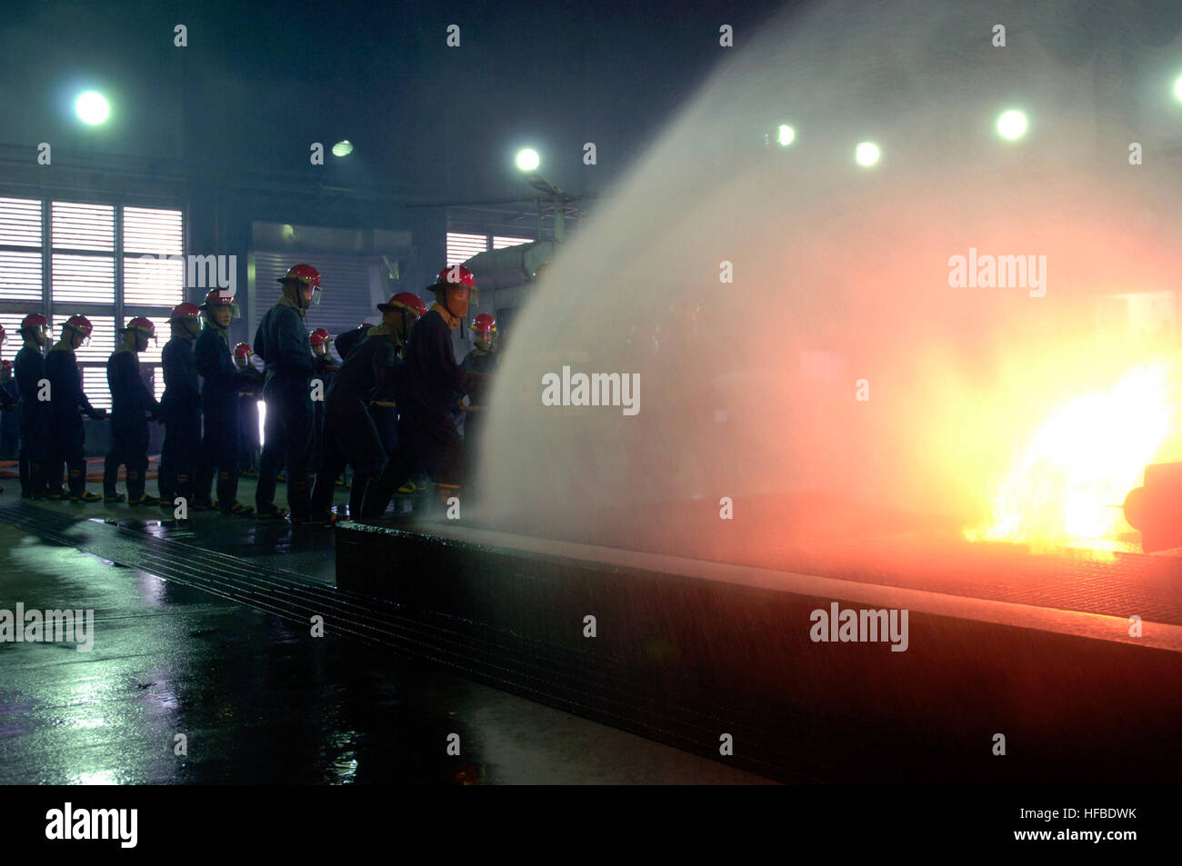 Sailors combat a live fire during high risk shipboard firefighting ...