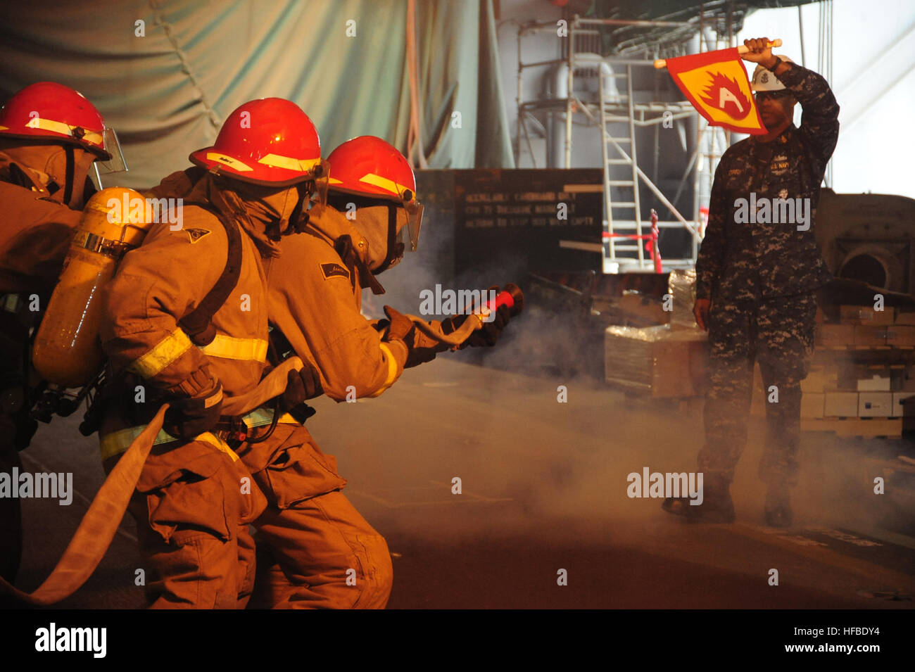 Sailors assigned to the in-port emergency team aboard the aircraft ...