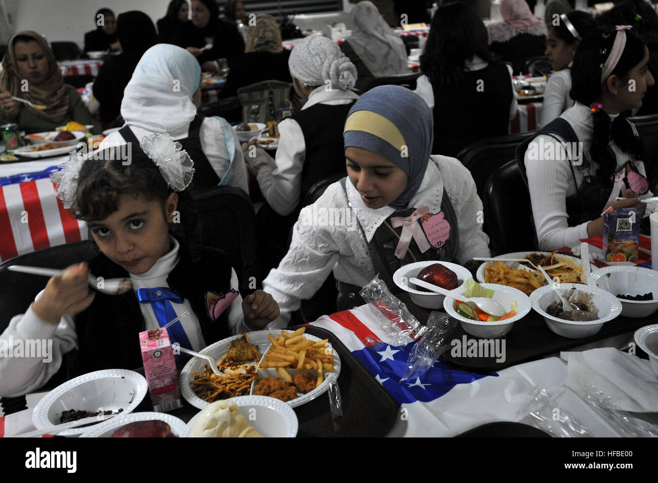 Iraqi children visit the chow hall at Forward Operating Base Falcon ...
