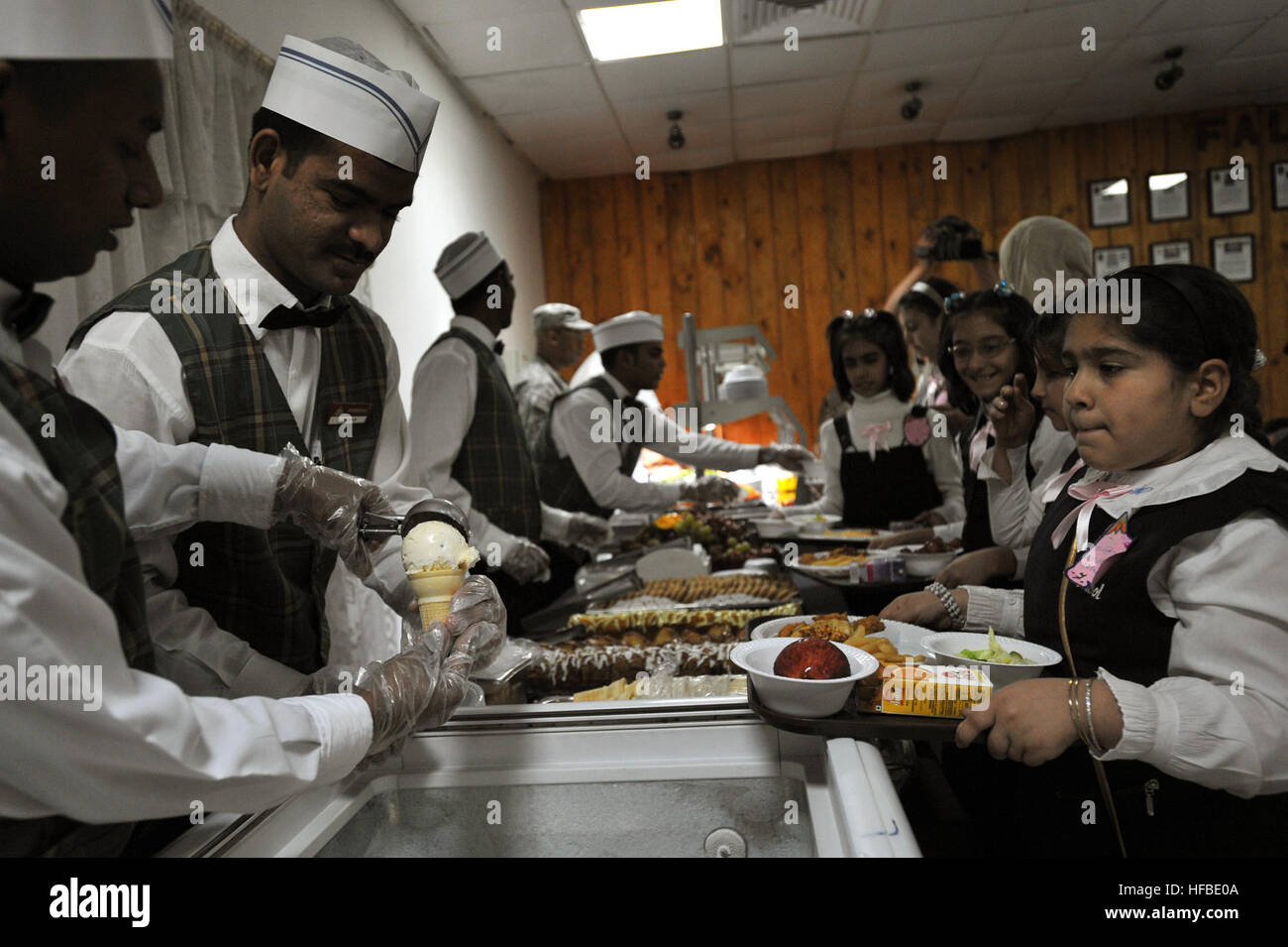 Iraqi children visit the chow hall at Forward Operating Base Falcon ...