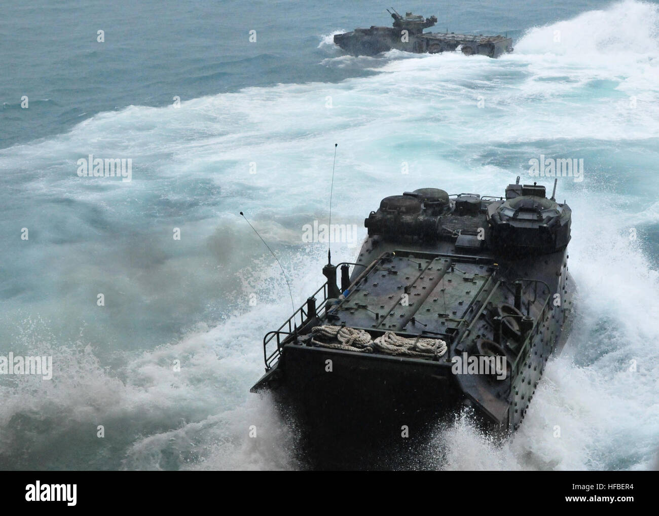 Amphibious assault vehicles are deployed from the USS Tortuga (LSD 46 ...