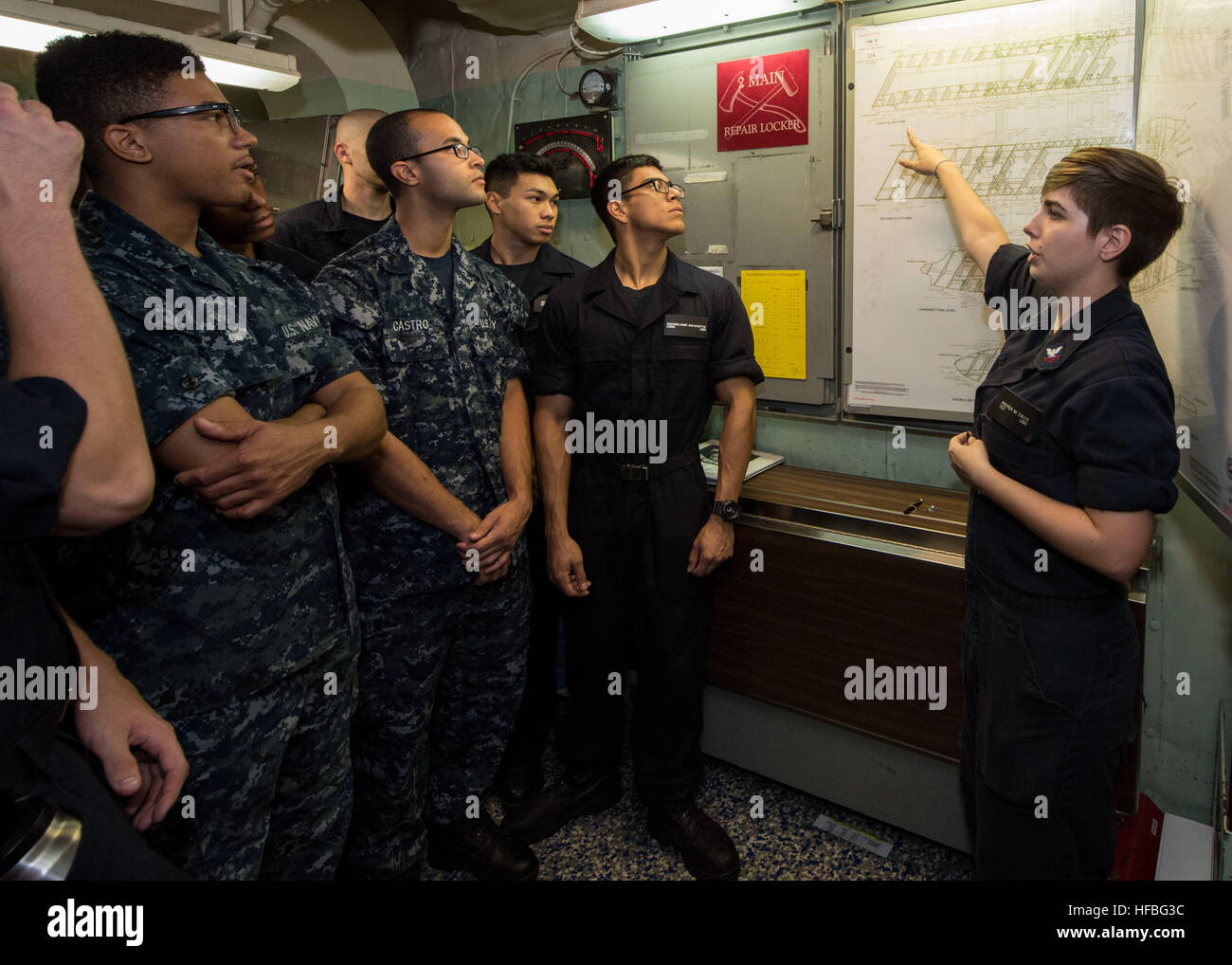 Damage Controlman 2nd Class demonstrates plotting procedures during ...