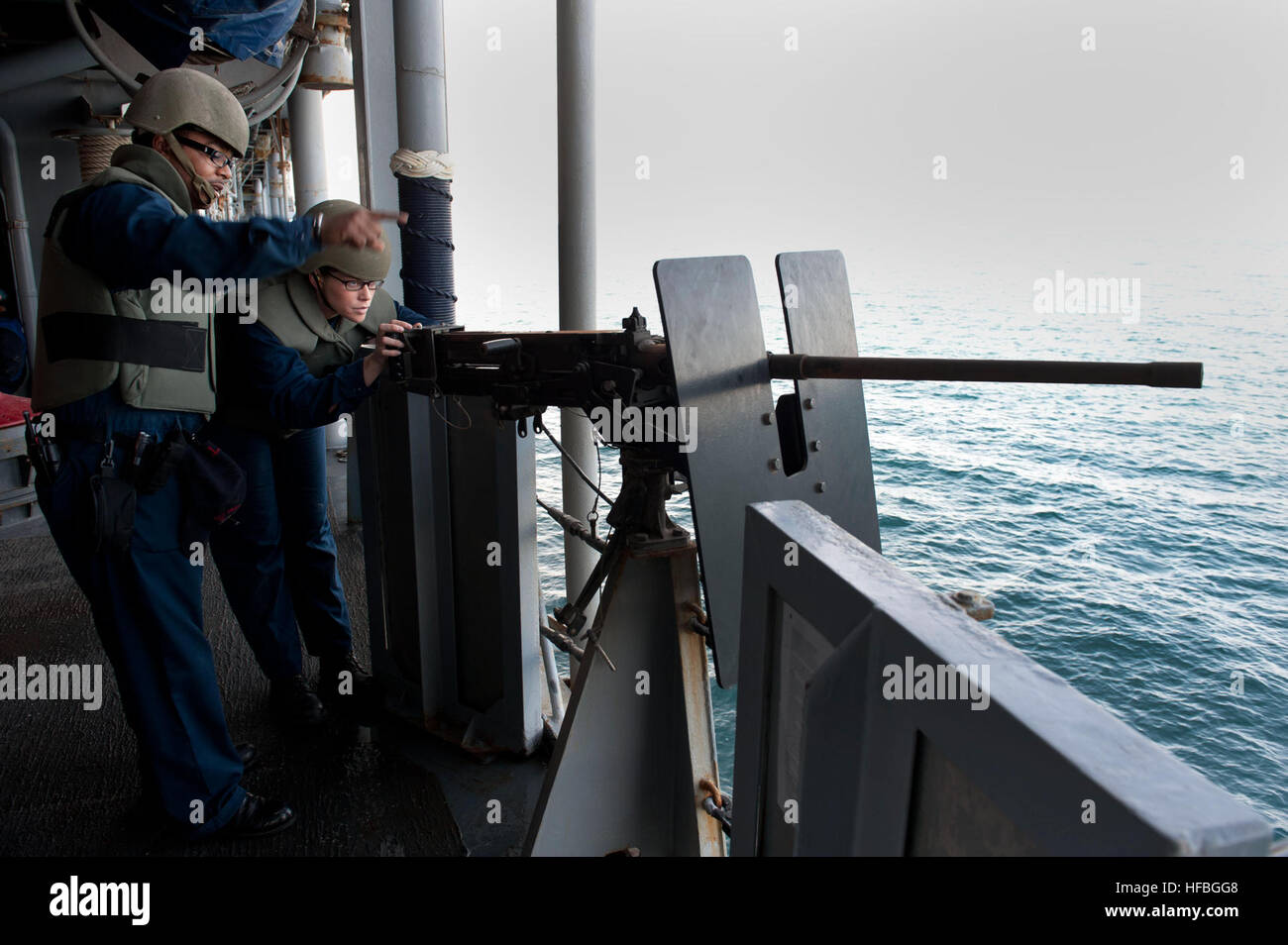 A Sailor aboard the amphibious dock landing ship USS Pearl Harbor ...