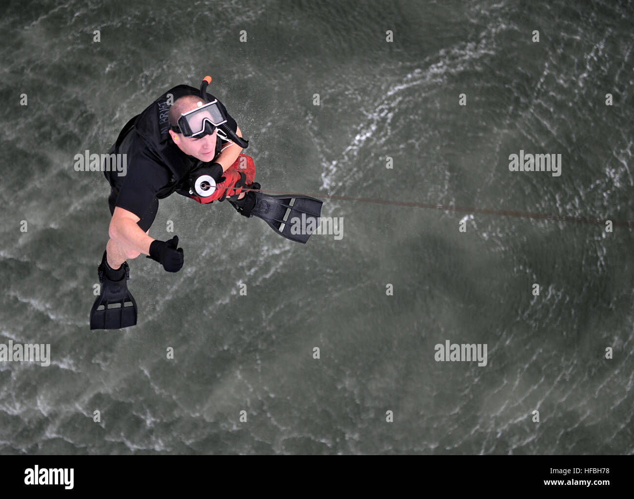 Search rescue swimmer hoisted helicopter hi-res stock photography and ...