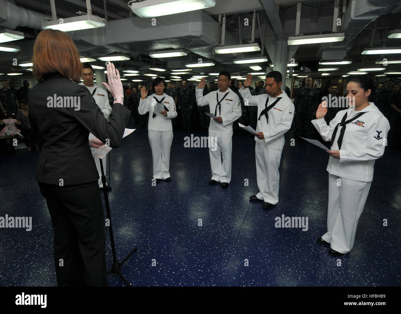 Sailors aboard USS Bataan take the oath of citizenship during a ...