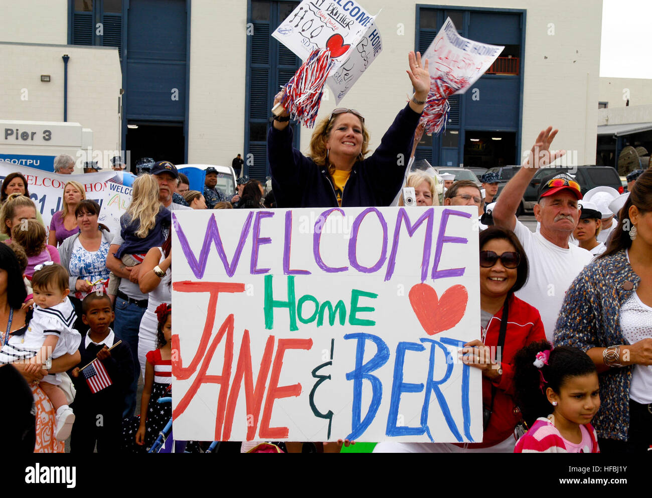 Family members wait for the return of USS Bunker Hill (CG 52) at Naval ...