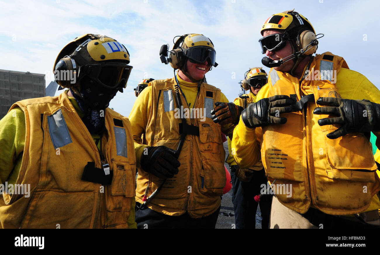 Sailors aboard USS Nimitz congratulate the flight deck chief of V-1 ...