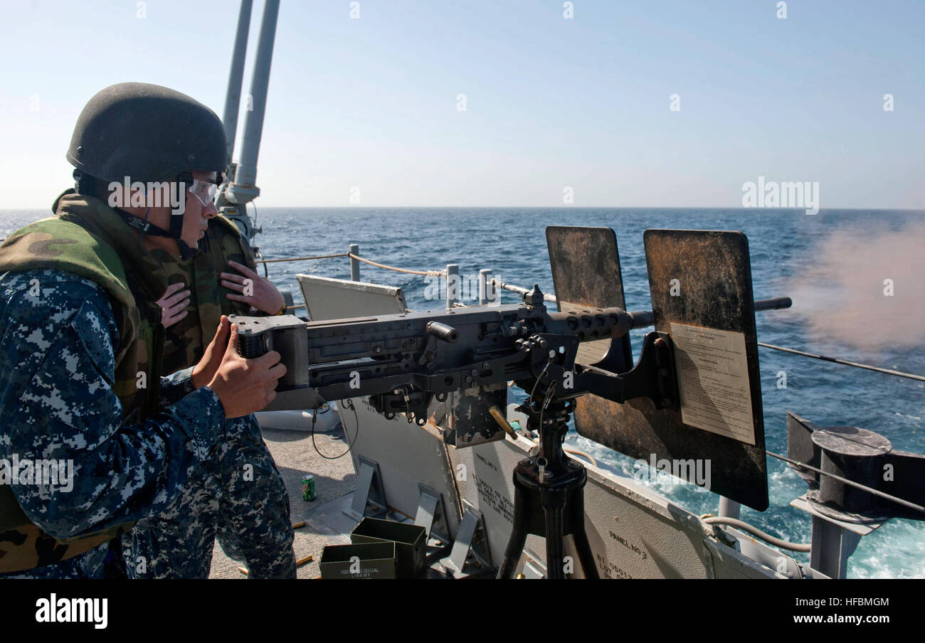 A Quartermaster fires a .50-caliber M2 Browning machine gun during a ...