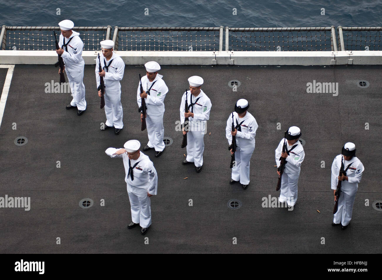 Firing squad stands ready to render a 21-gun salute during a burial at ...