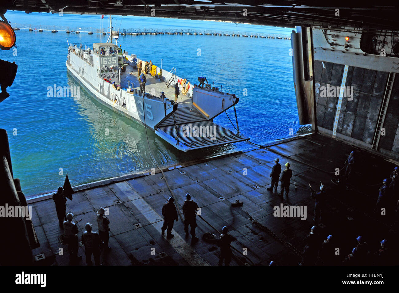 Sailors aboard LCU 1635 and amphibious assault ship USS Peleliu (LHA-5 ...