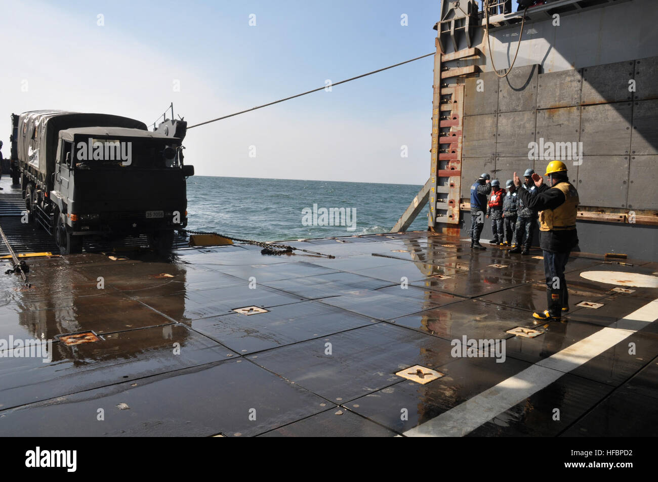 USS Tortuga (LSD 46) transports humanitarian supplies with the ...