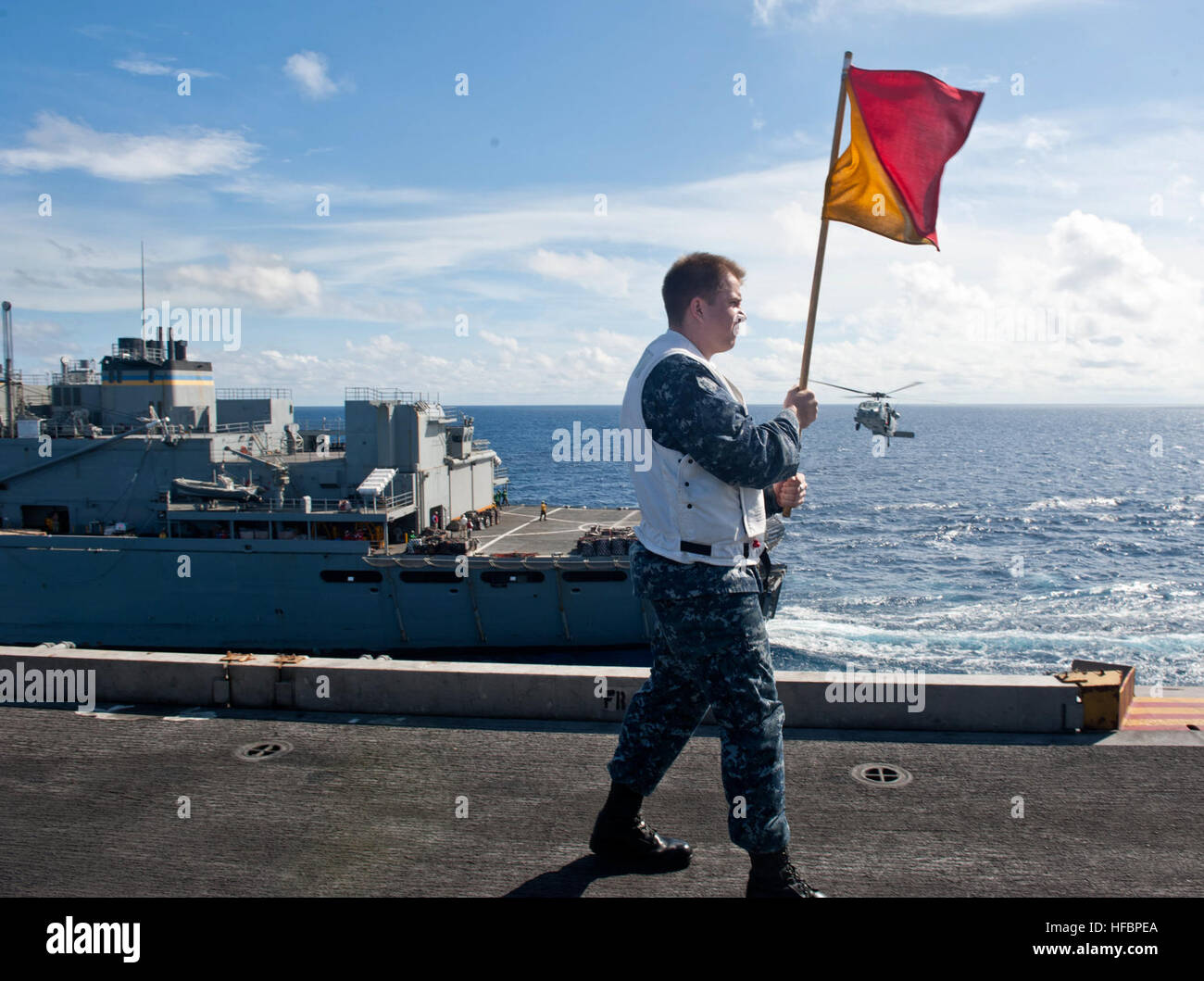 ANDAMAN SEA (Oct. 12, 2012) Quartermaster Seaman Jeremy Fox signals to ...