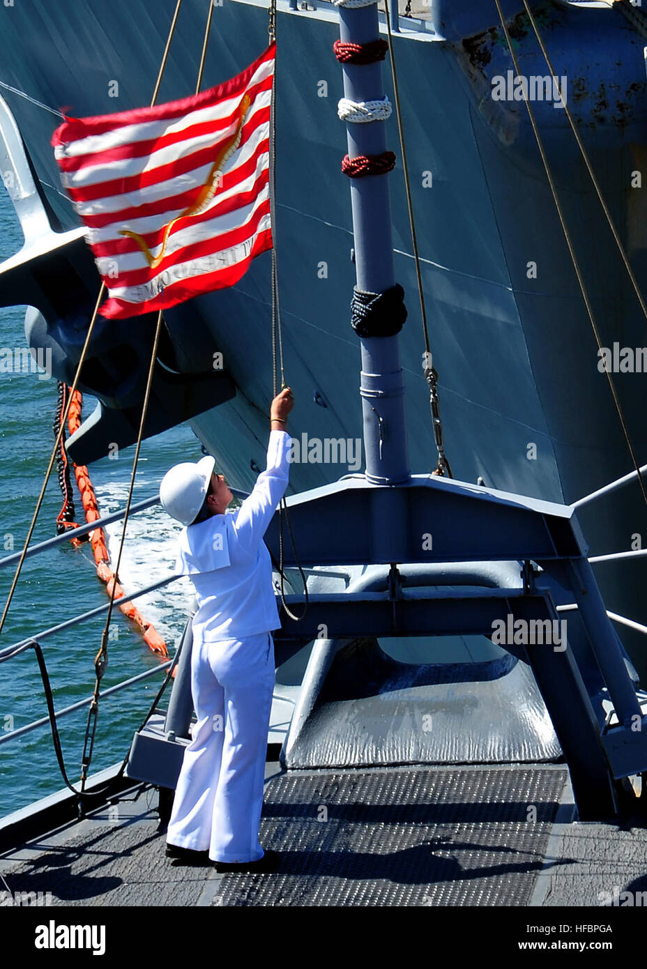A sailor aboard USS Rushmore (LSD 47), an amphibious dock landing ship ...