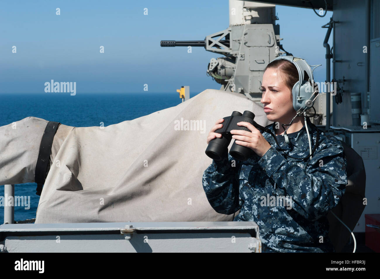 A seaman stands aft lookout watch aboard the amphibious assault ship ...