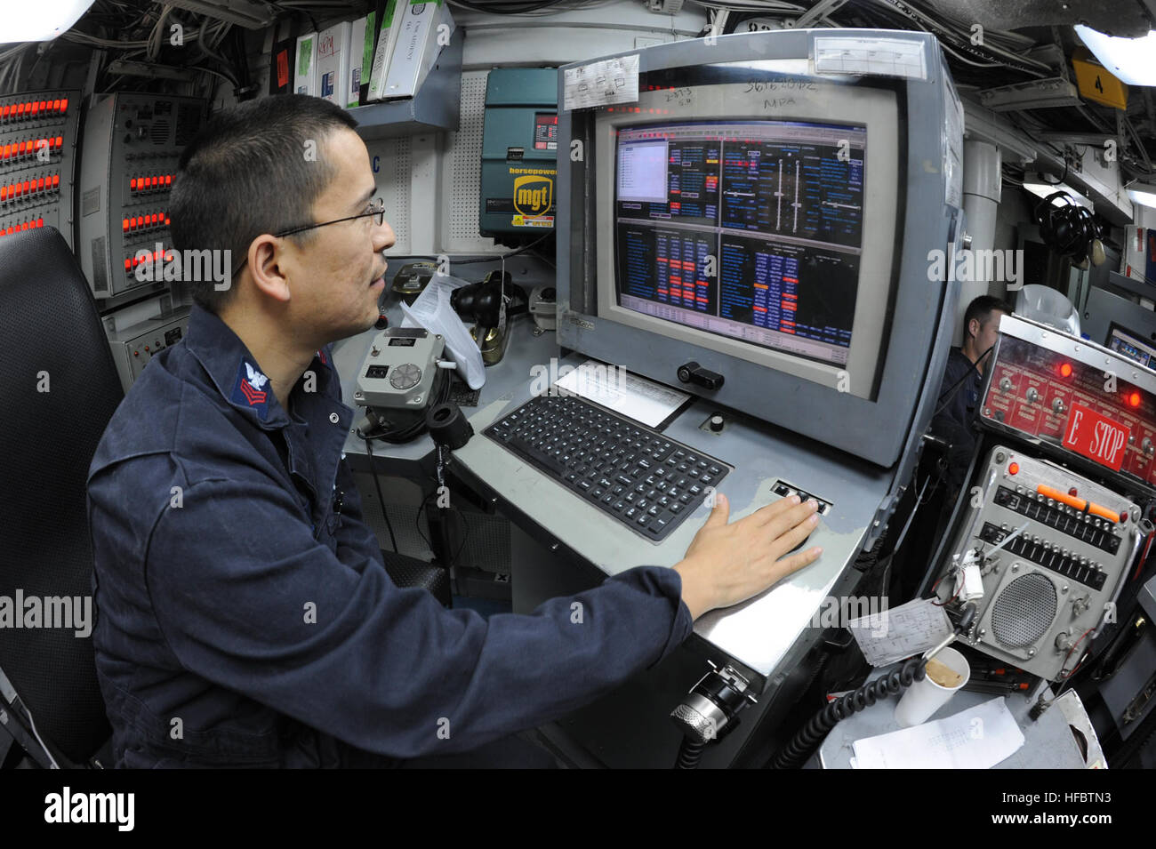 Aboard USS Ardent, an Electrician's Mate monitors the electronic ...