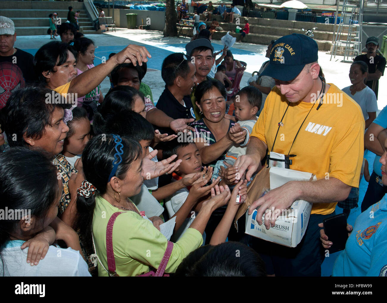 Sailors aboard submarine tender USS Frank Cable provide community ...