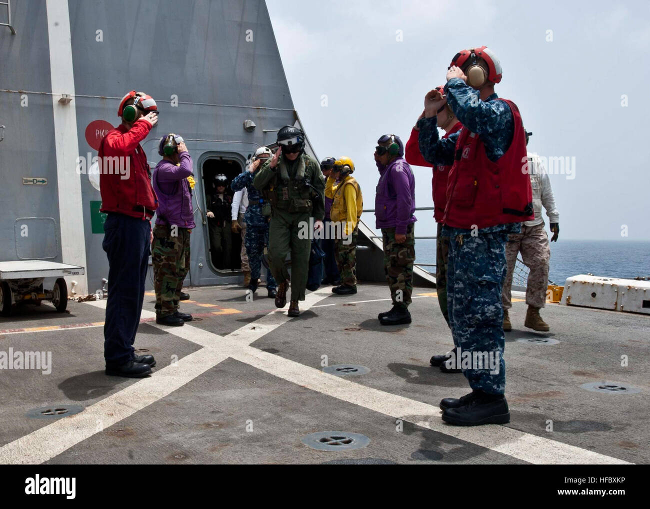 U.S. Navy side boys render honors to U.S. Navy Capt. Dave Silkey ...