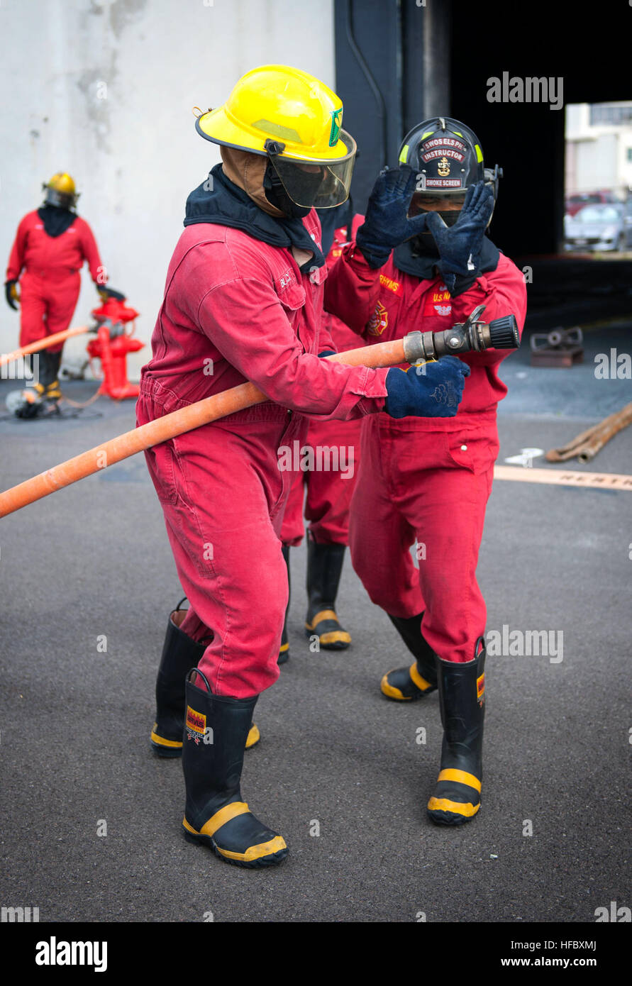 Firefighting hose handling techniques hi-res stock photography and ...