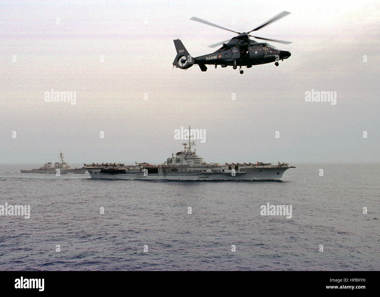 The French carrier FOCH CV (R-99) is being escorted by the guided ...