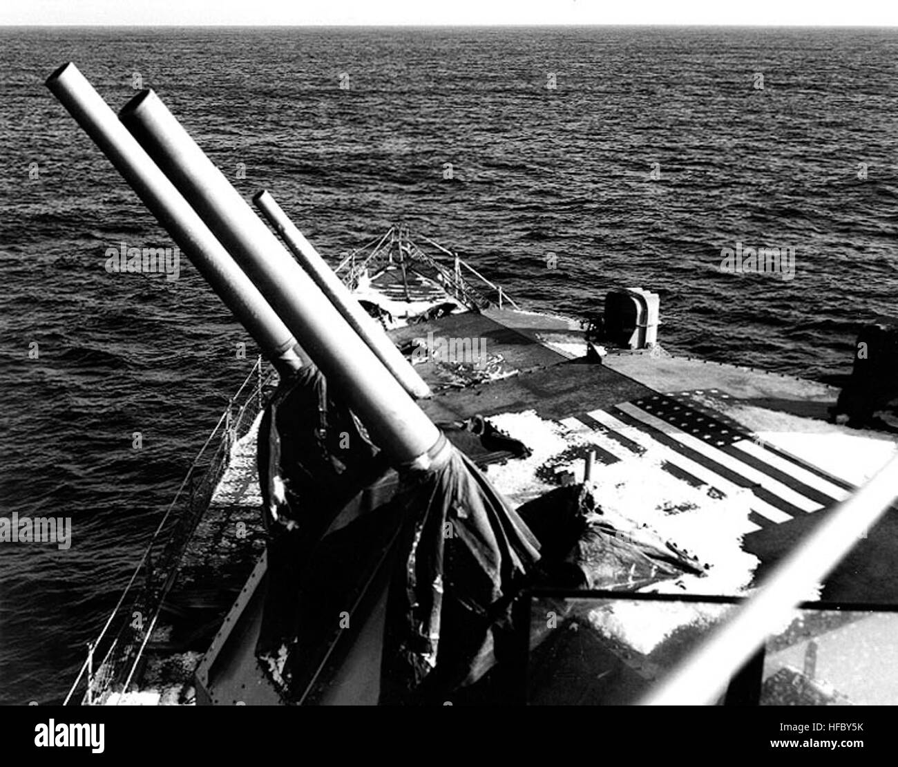 The destroyer USS Hyman (DD‑732) trains its forward 5-inch/38‑caliber ...