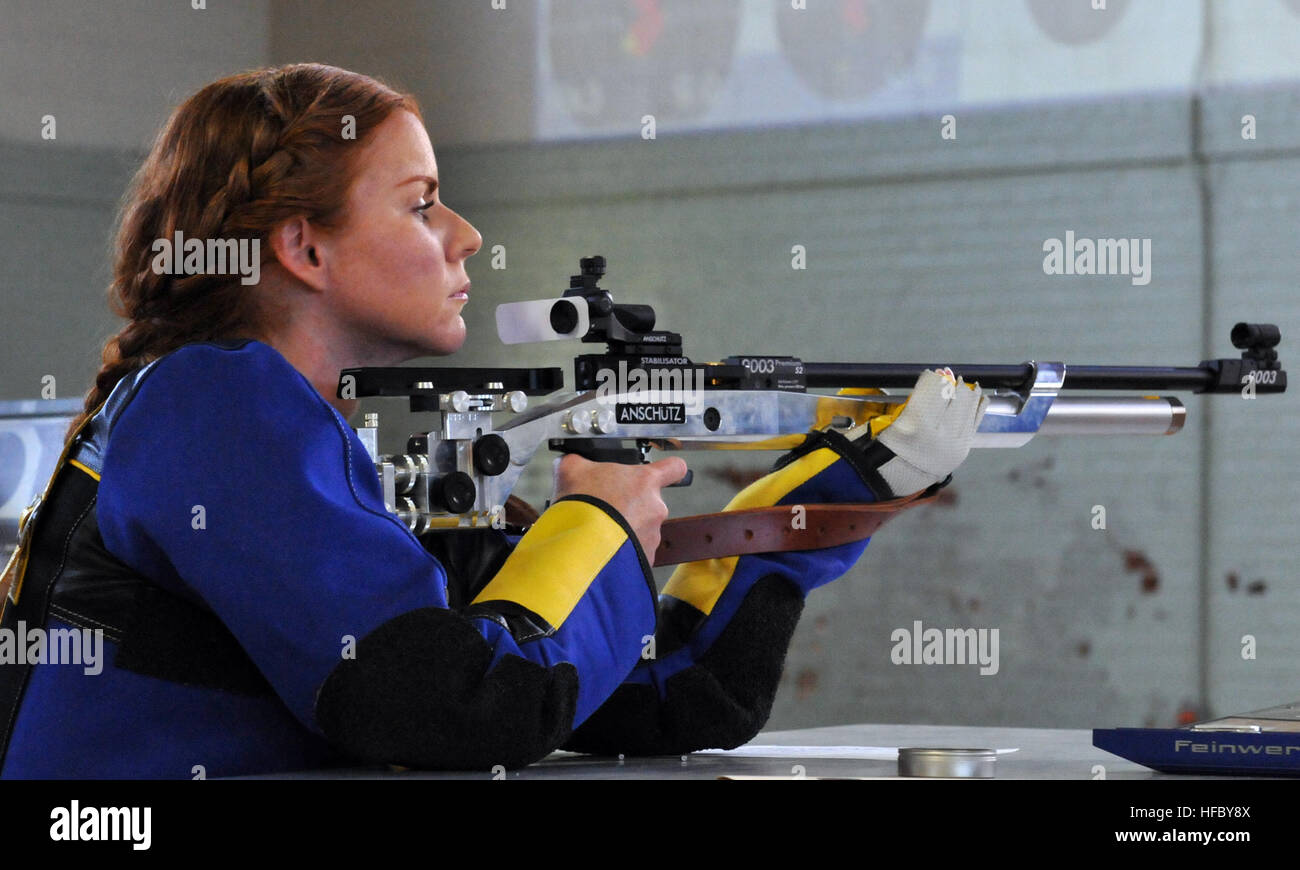 Retired Navy Legalman 1st Class Shahnaz Askins prepares to fire her ...