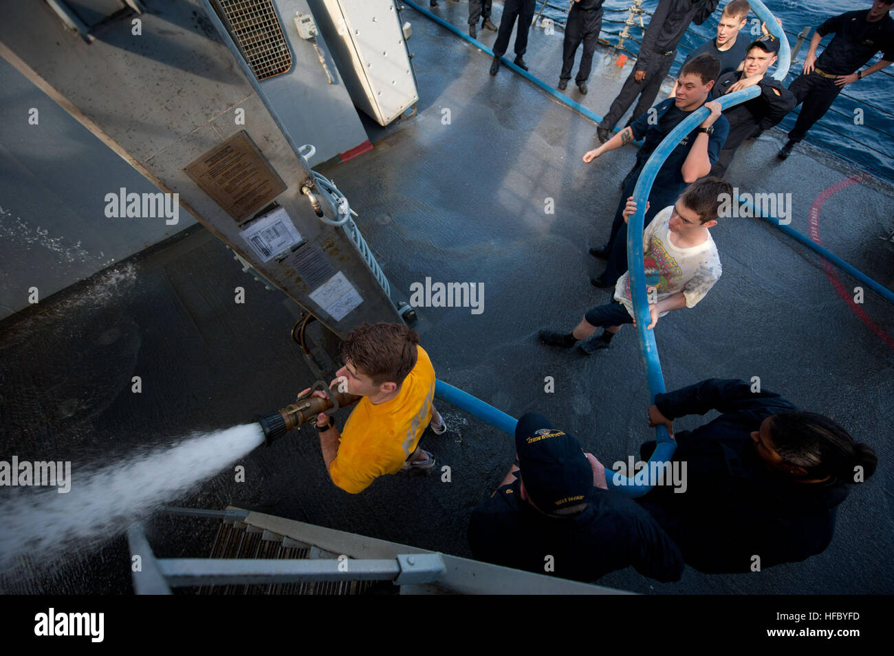 140221-N-WD757-197 ATLANTIC OCEAN (Feb. 21, 2014) Sailors wash away sea ...