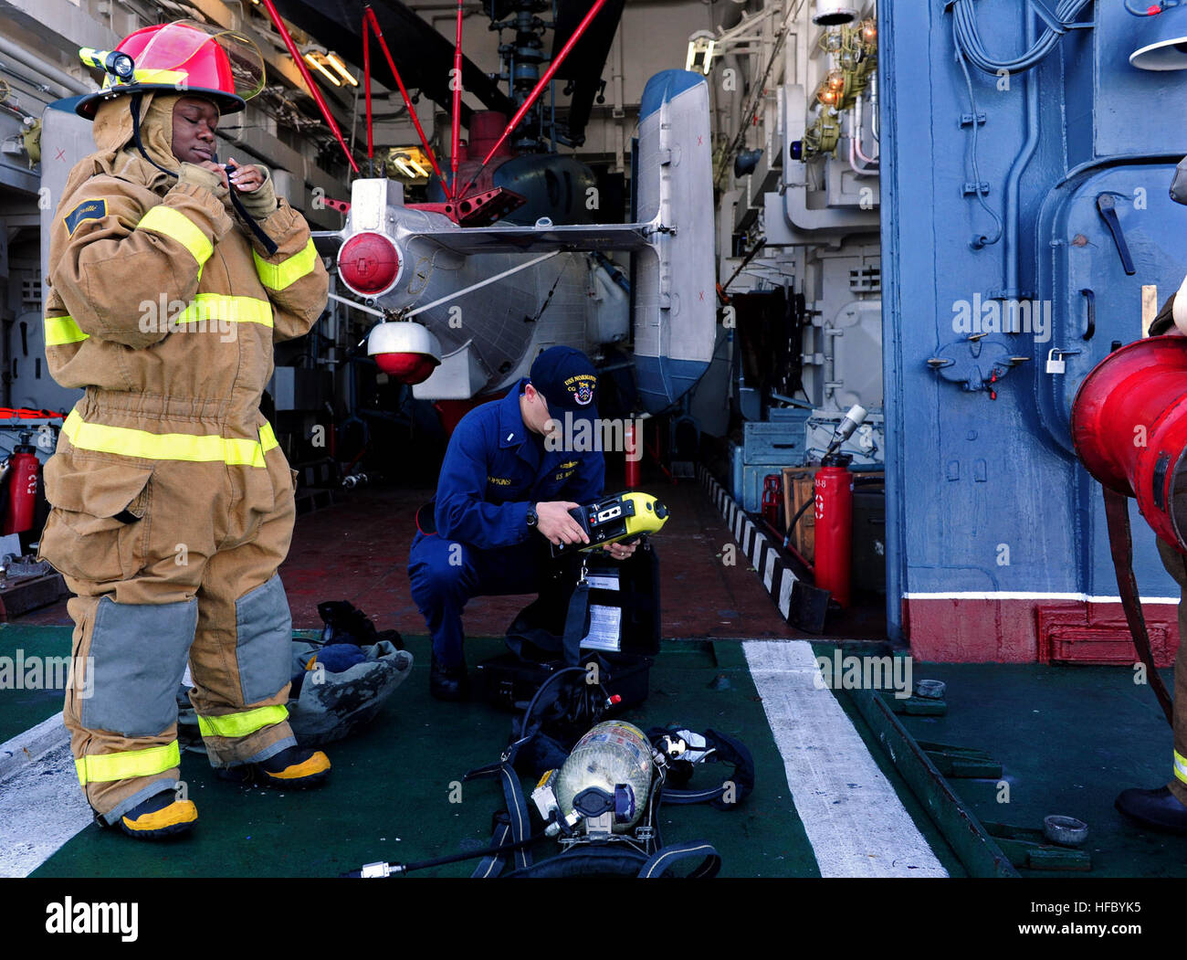 Chief Damage Controlman Teresa McGee, left, and Lt. j.g. Steven Hopkins ...