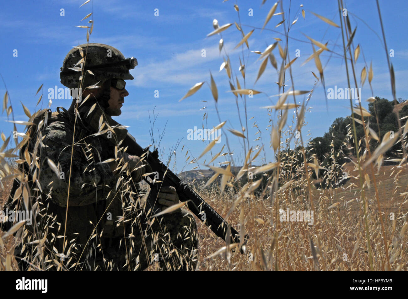 Construction Mechanic 3rd Class Paul Tersteege watches Forward ...