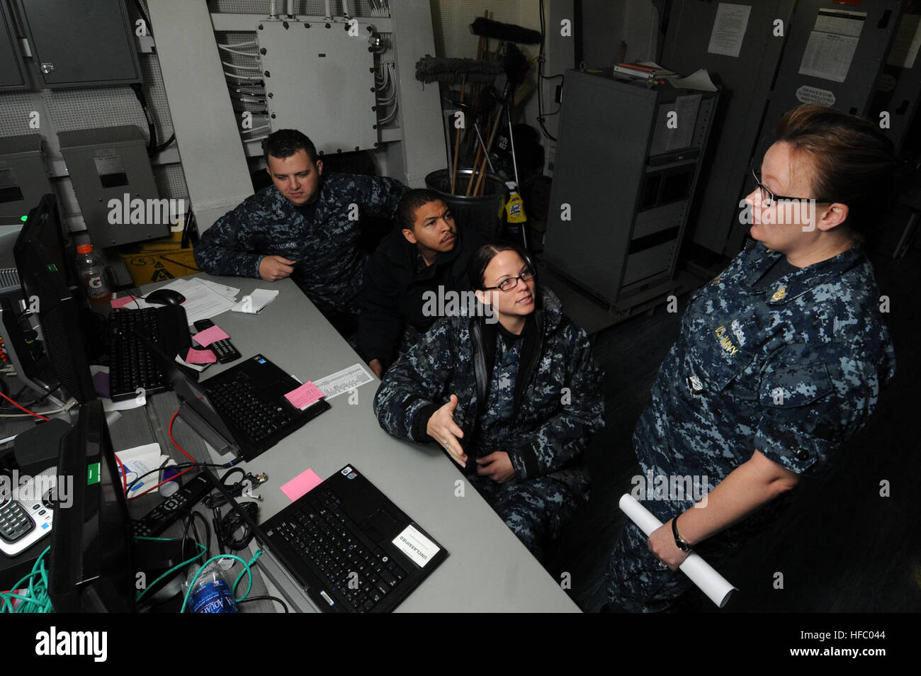 From left to right, U.S. Navy Information Systems Technician 3rd Class John Erskine, Cryptologic ...
