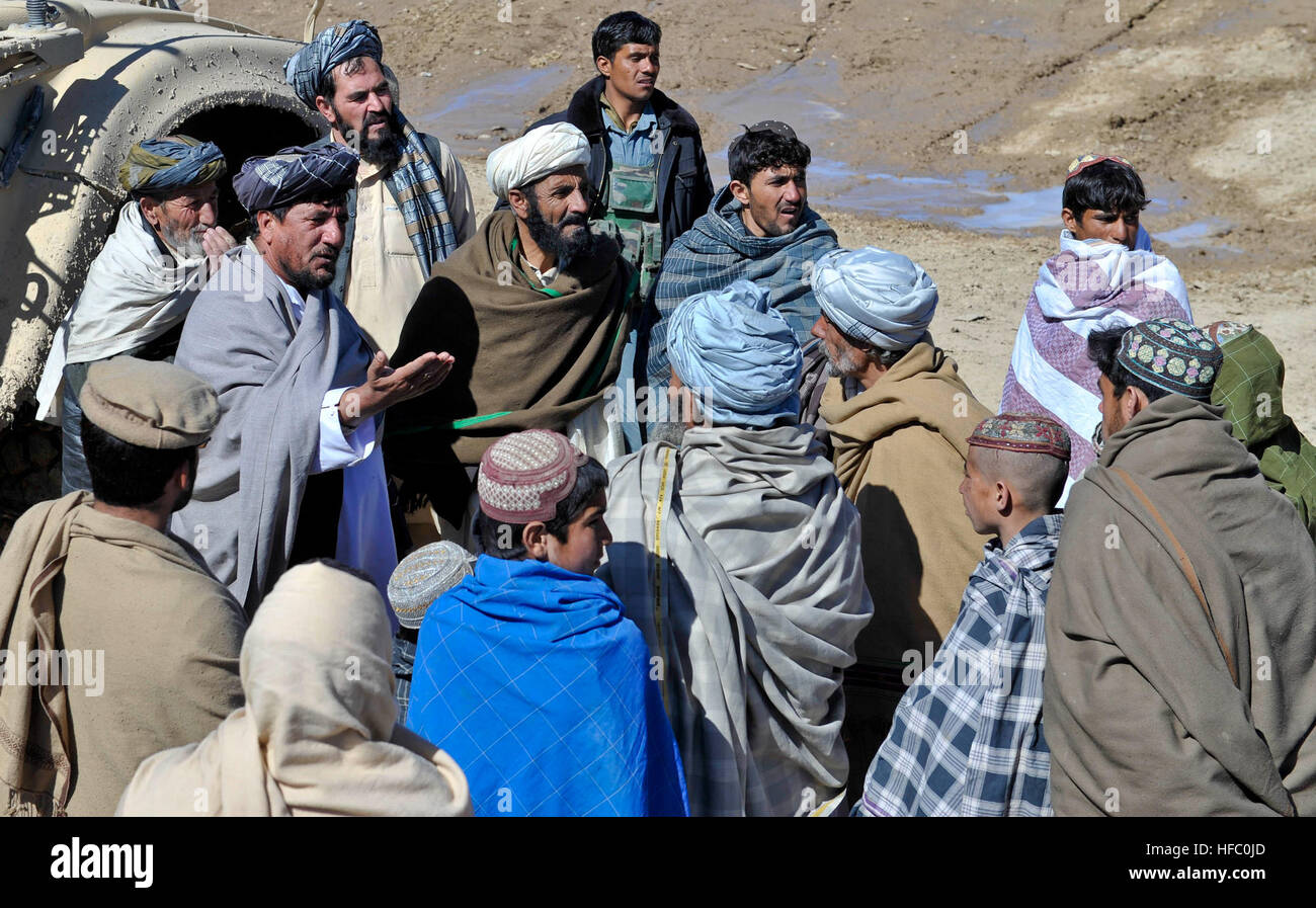Mohammad Sadiq, Shah Joy District Governor, speaks to villagers in ...