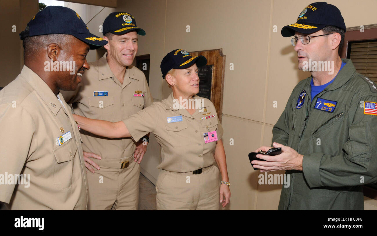 Vice Adm. John M. Bird, commander of U.S. 7th Fleet, is greeted by Capt ...
