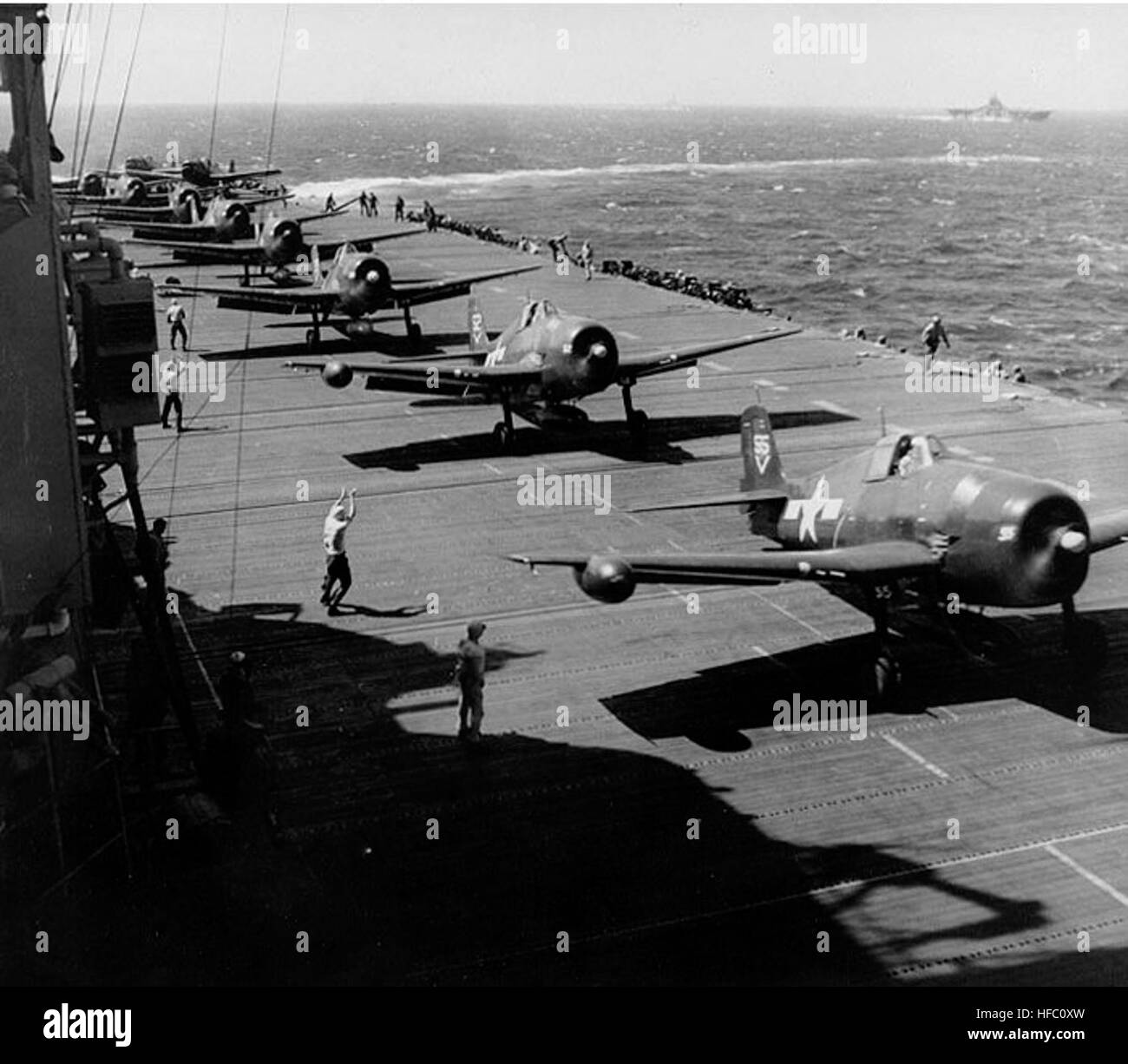 A Grumman F6F Hellcat fighter aircraft operates aboard the aircraft ...