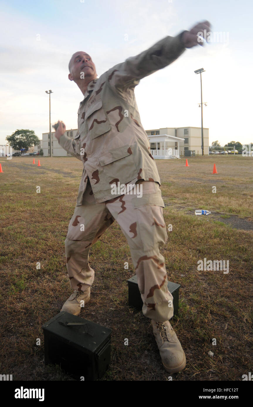 Navy Lt. Cmdr. Raul Eliza, with Joint Task Force Guantanamo, throws a ...