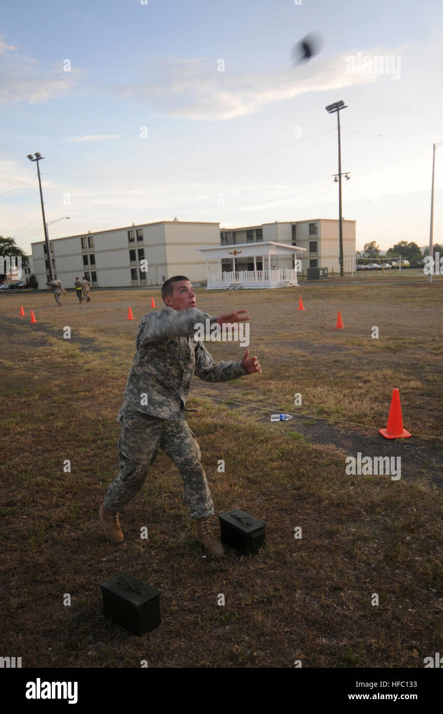 Army Pfc. Wayne Hodge, with Joint Task Force Guantanamo, throws a dummy ...