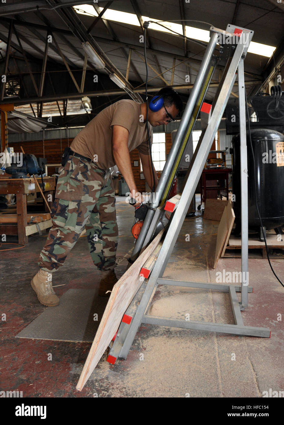Utilitiesman 2nd Class German Garcia, assigned to Naval Facilities ...