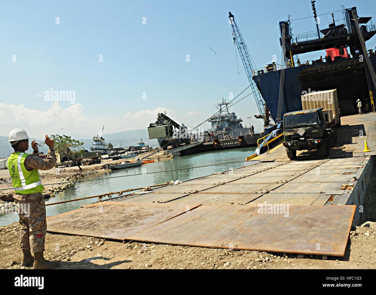 Service members conducting joint logistics over the shore operations at ...