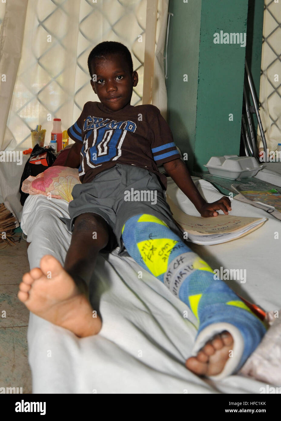 A little boy recovers from his leg injuries at the Milot hospital that ...