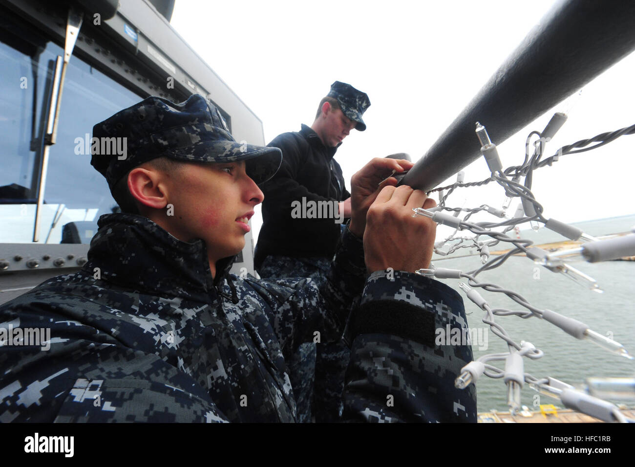 U.S. Navy Gunner's Mate 3rd Class Gregory Pitts, left, and Gunner's ...