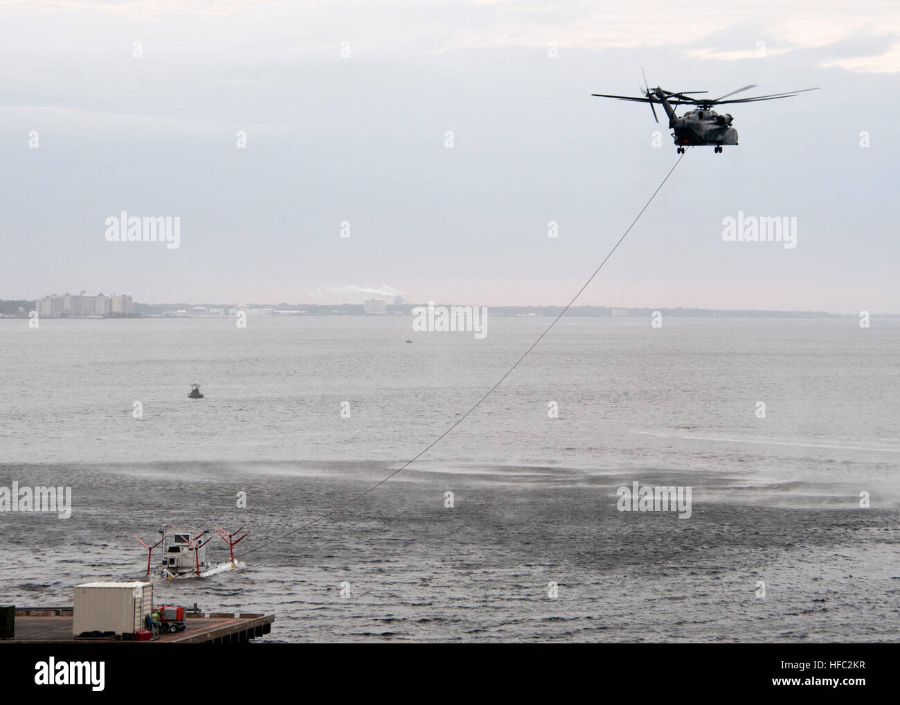 HM-14 Squadron Sailors flying a MH-53E Sea Dragon tow the MK-15 magnetic influence sweep system ...