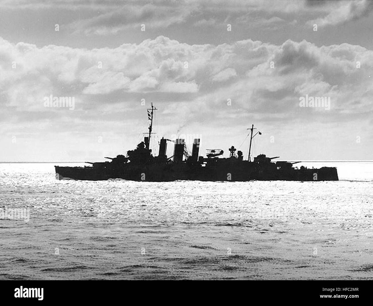 (Australian Heavy Cruiser, 1928) Silhouetted against the sun, while at ...