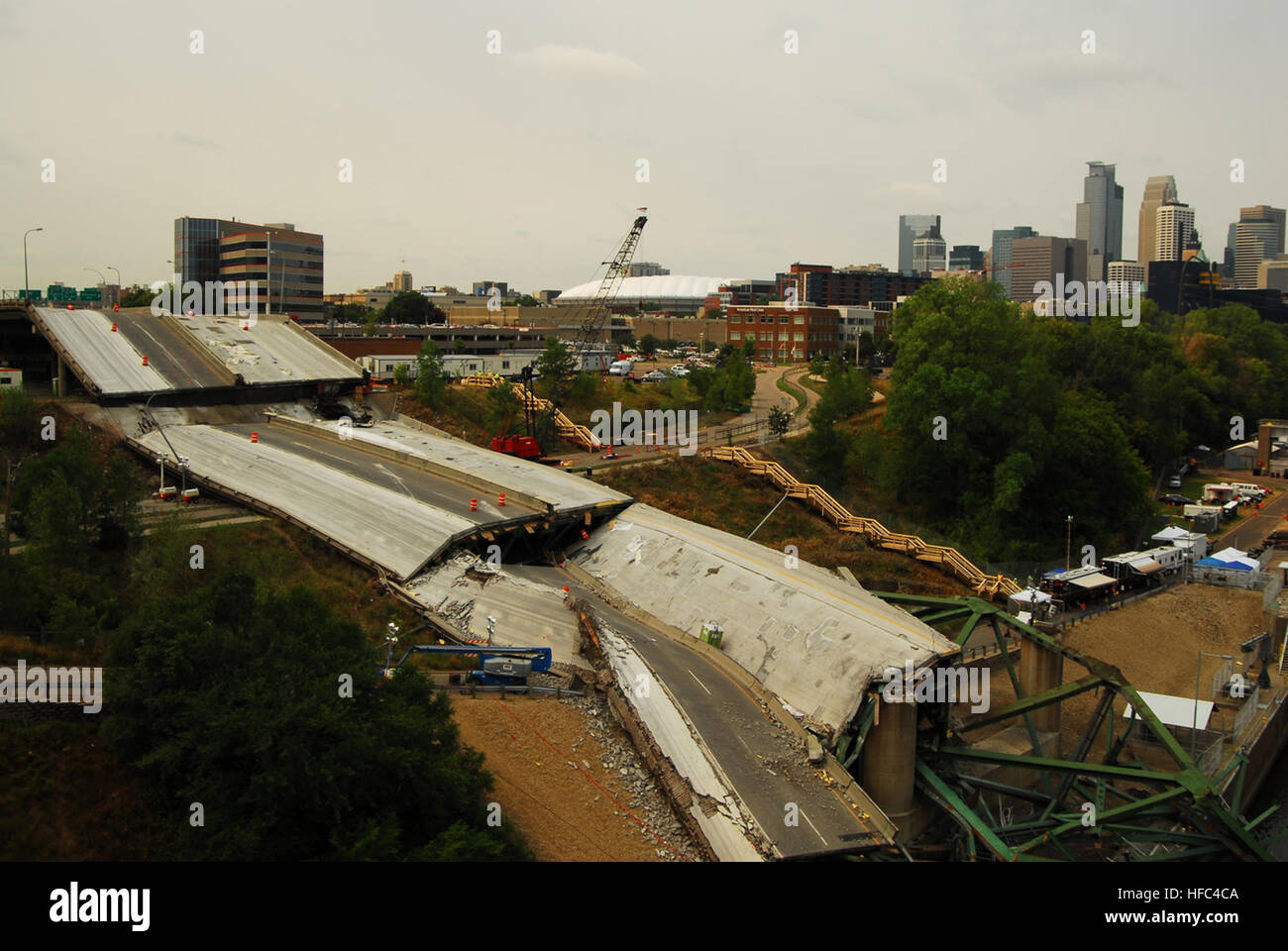 Debris lays scattered in the Mississippi River and at the site of the I ...