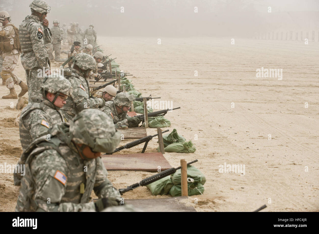 Sailors get dirty in order to zero in their M16A2 rifles for maximum ...