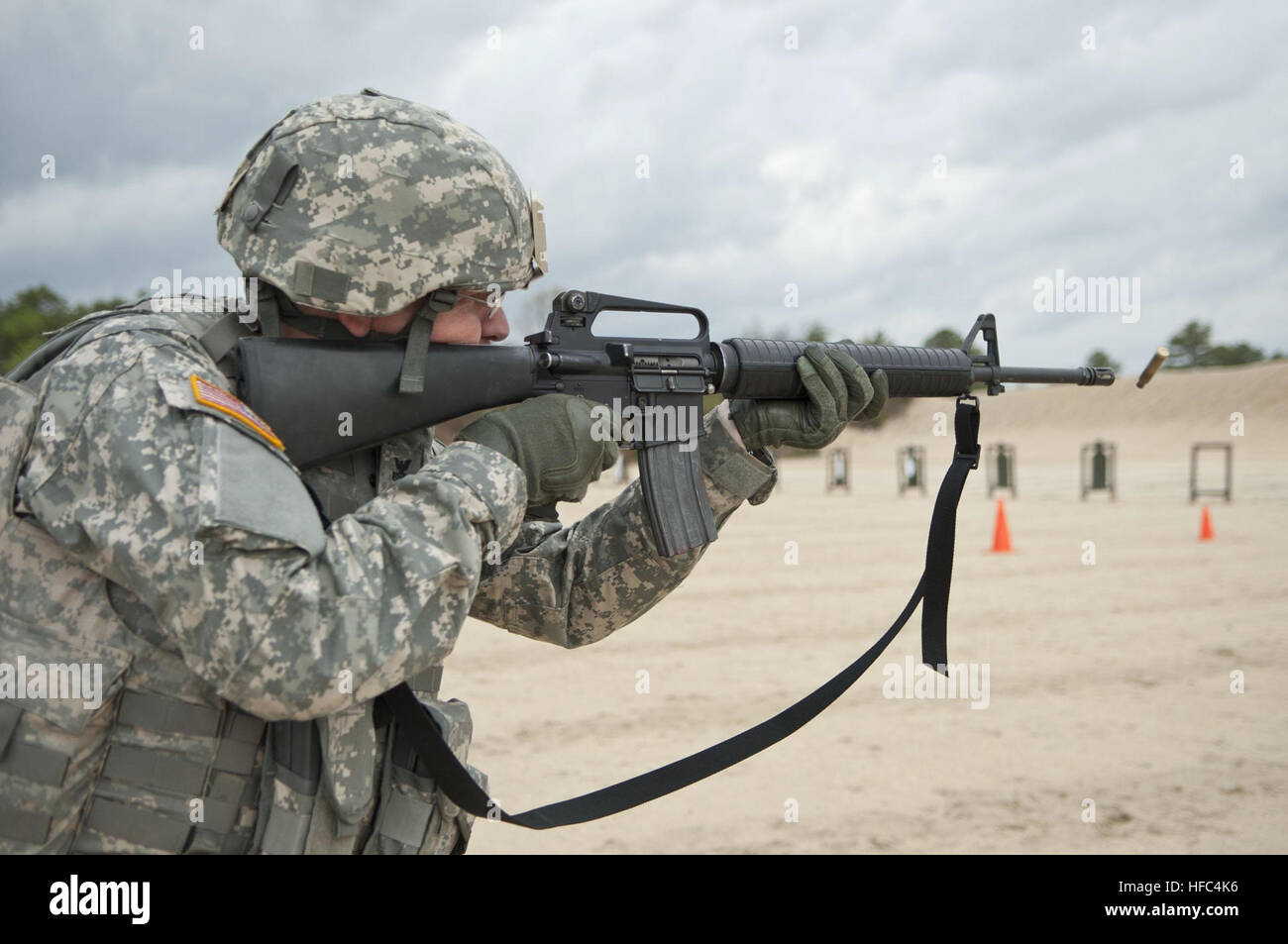 Petty Officer 1st Class Kurt Wesseling fires an M16A2 during the U.S ...