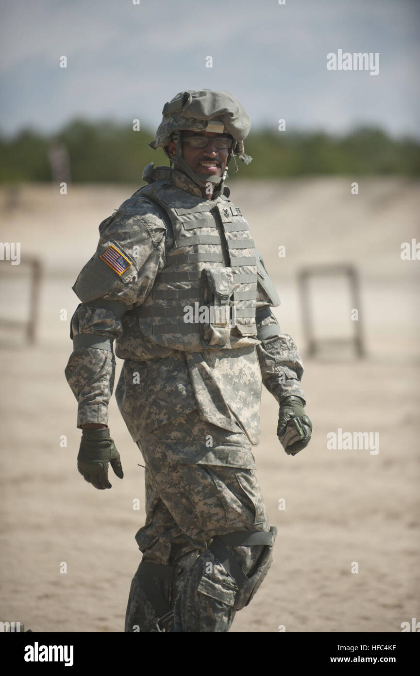 Petty Officer 1st Class Leron Renfro, an operation specialist, walks ...